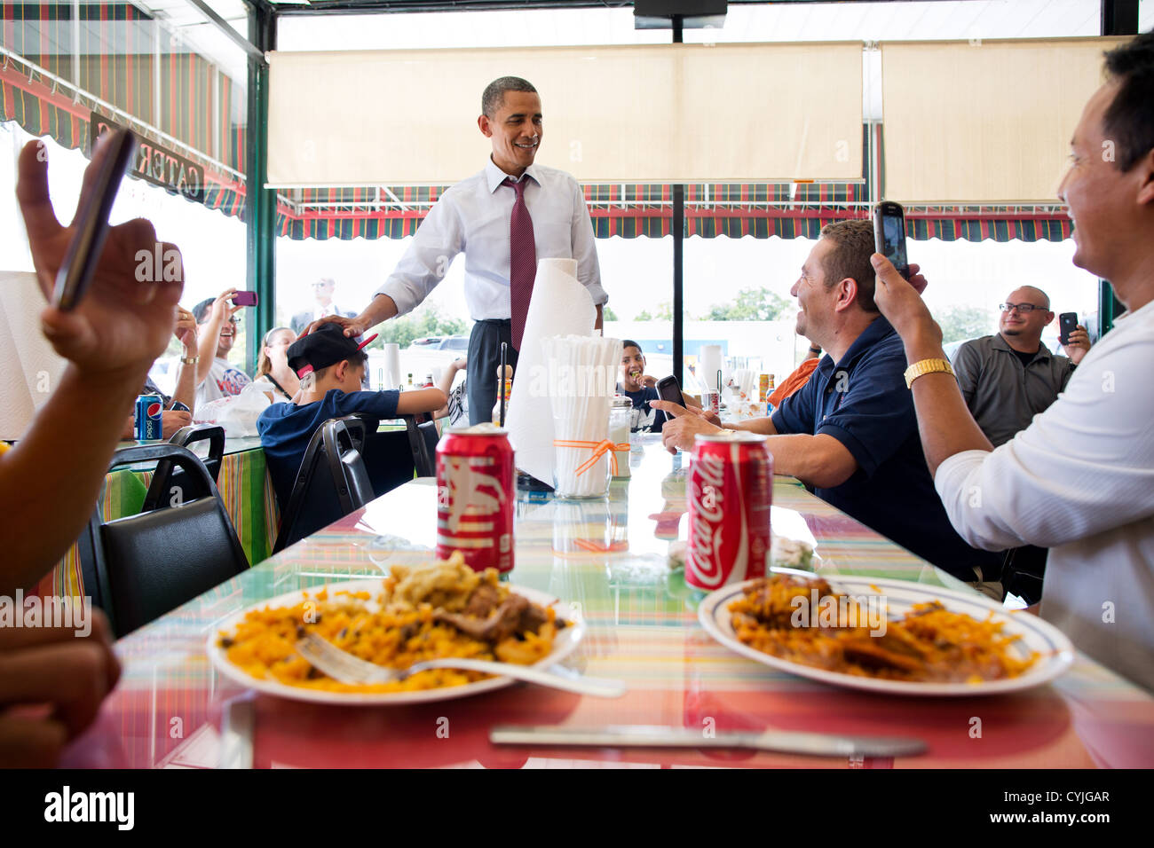 US President Barack Obama talks with diners at Lechonera El Barrio ...