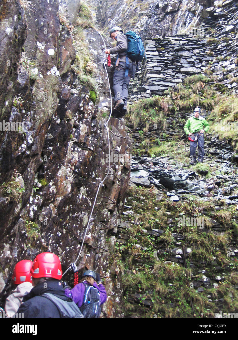 Tourists follow a Via Ferrata route at Honister Slate Mine in the Lake ...