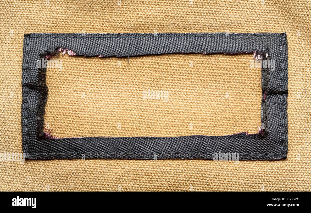 Torn fabric label. Background for text Stock Photo - Alamy