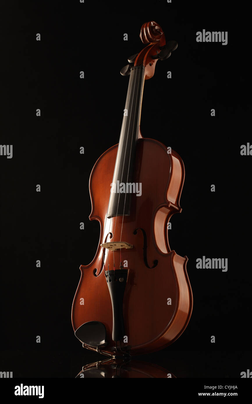 Elegant shot of a violin on black background Stock Photo - Alamy