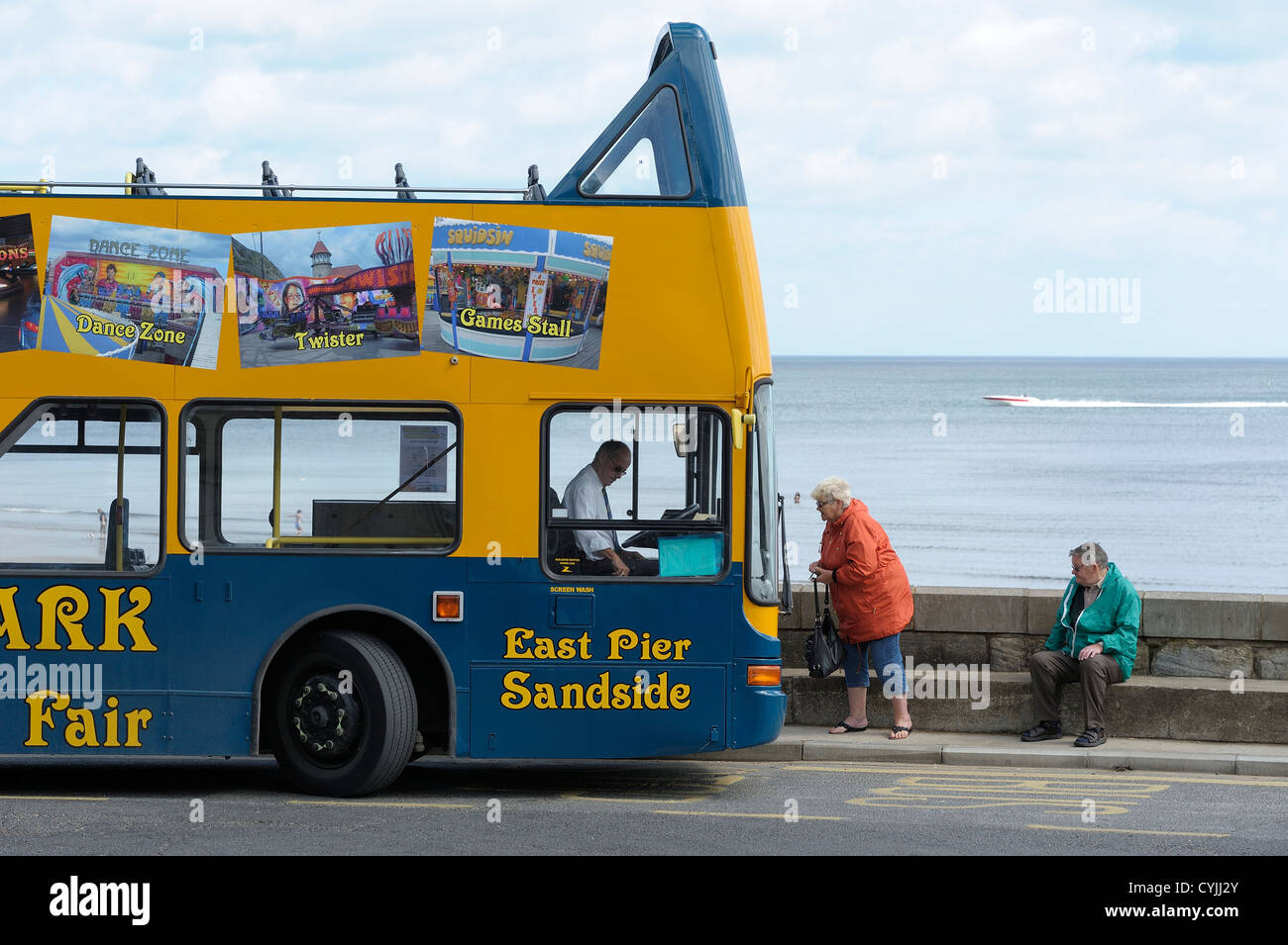 people boarding an open topped bus for a sightseeing tour of ...