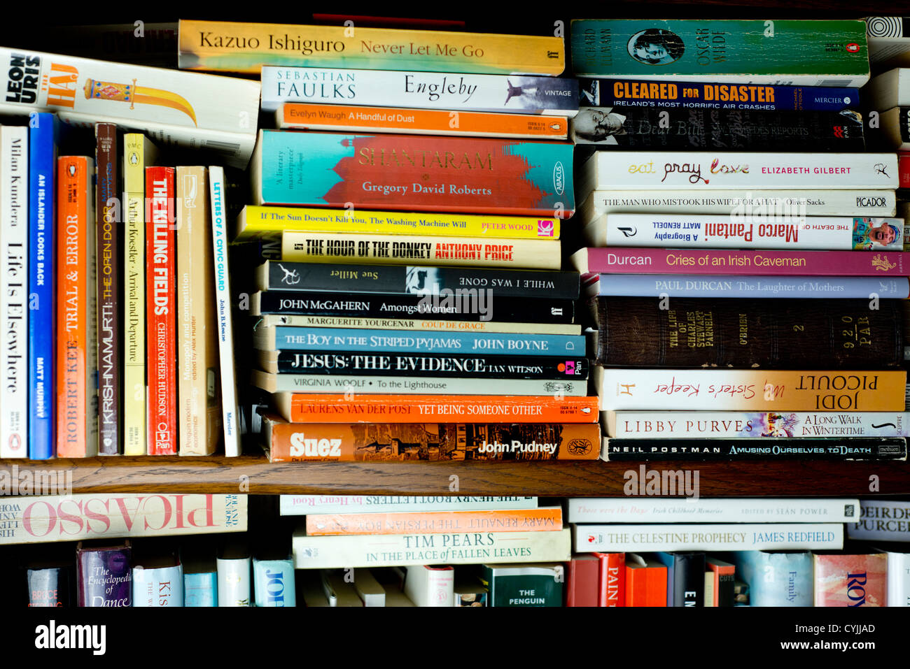 stacks of paperbacks on a shelf Stock Photo - Alamy