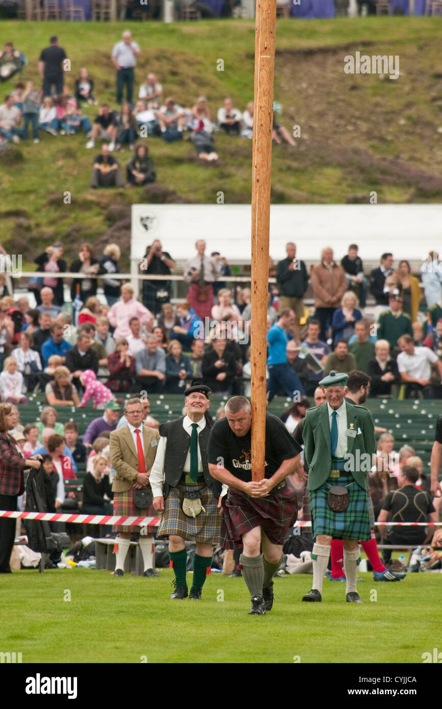 Competitor in Toss the Caber at the Braemar Royal Highland Gathering ...