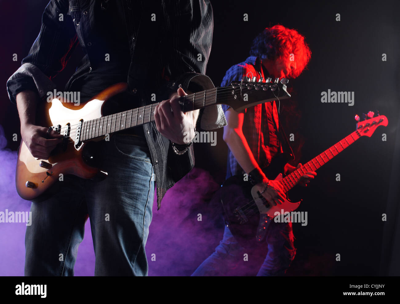 rock musicians playing at a live concert Stock Photo - Alamy