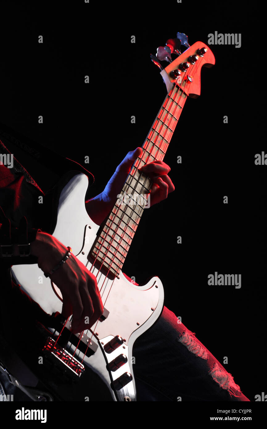 a bassist plays at a live concert Stock Photo - Alamy