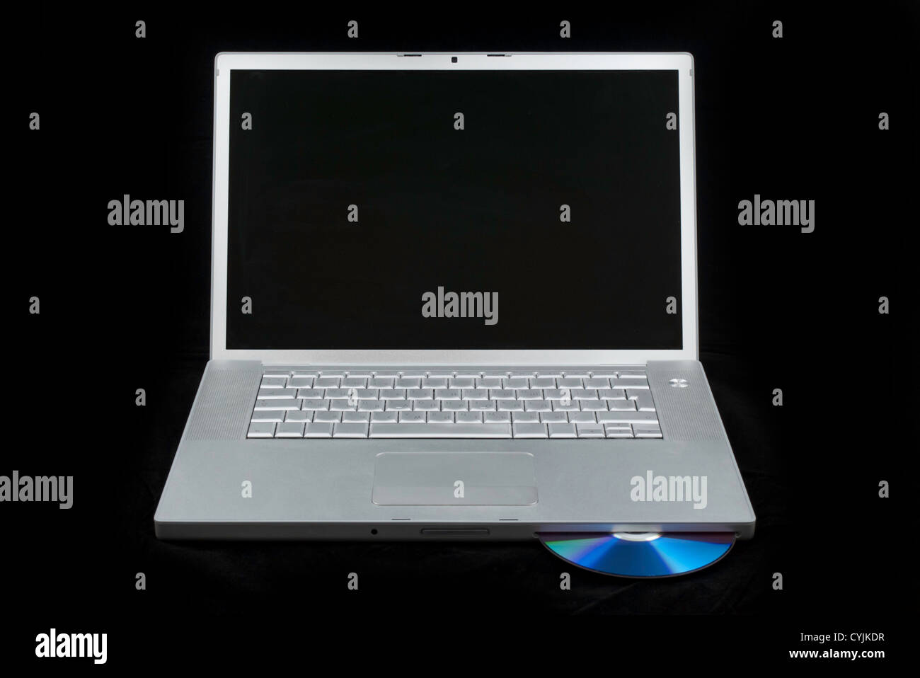 Silver portable computer with CD inserted. Front view Stock Photo - Alamy