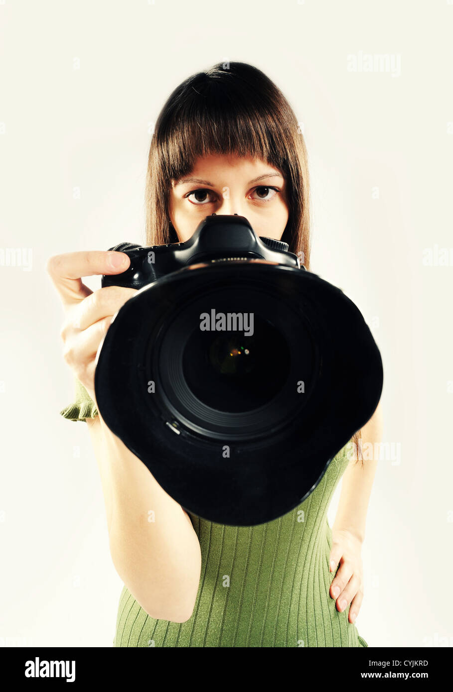 Woman taking a photo with a digital SLR camera with a digital SLR ...