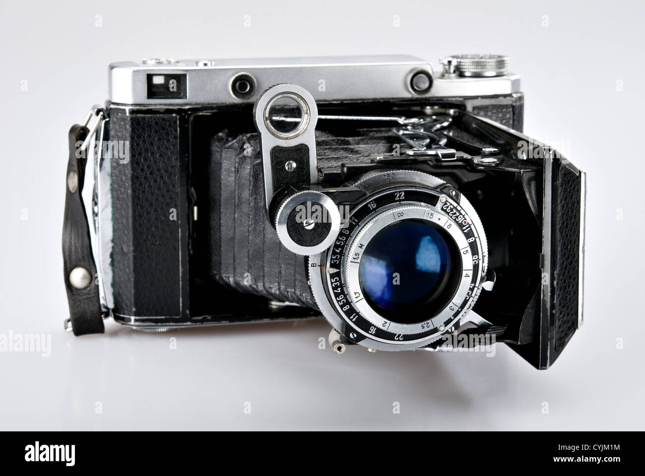 Old vintage photo camera isolated on white background Stock Photo - Alamy