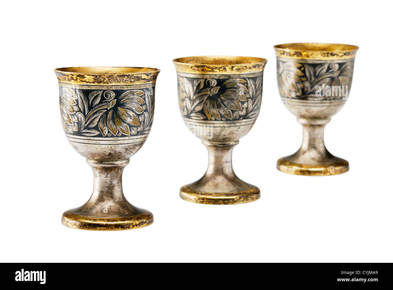 Three ancient wine cup in a line isolated over white background Stock ...