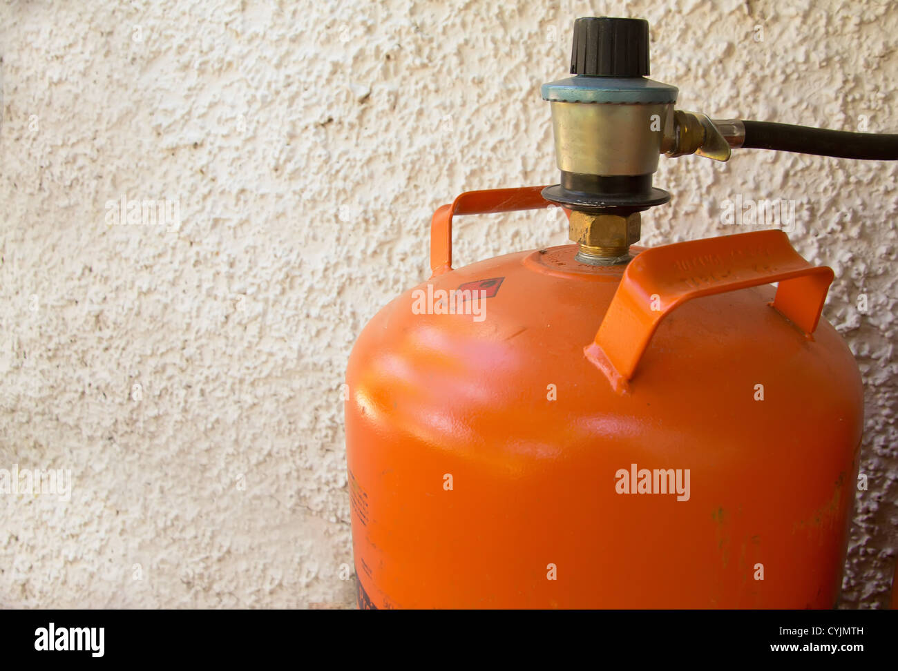 a butane gas orange cylinder Stock Photo - Alamy