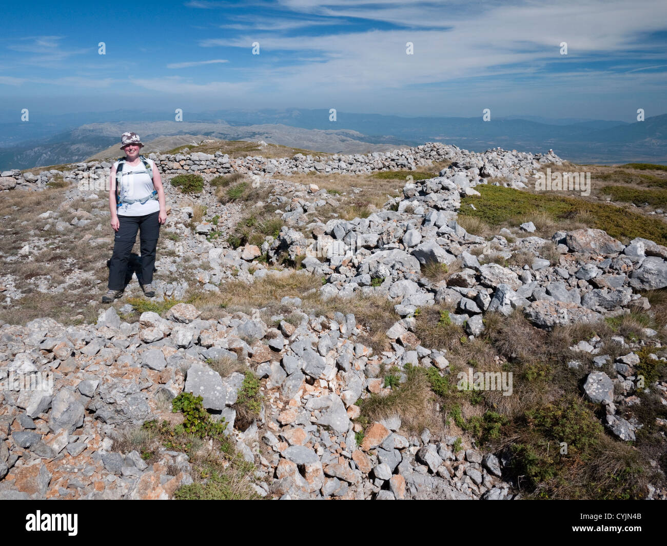 A female hiker amid WWI groundworks near the summit of Magaro (2245m ...