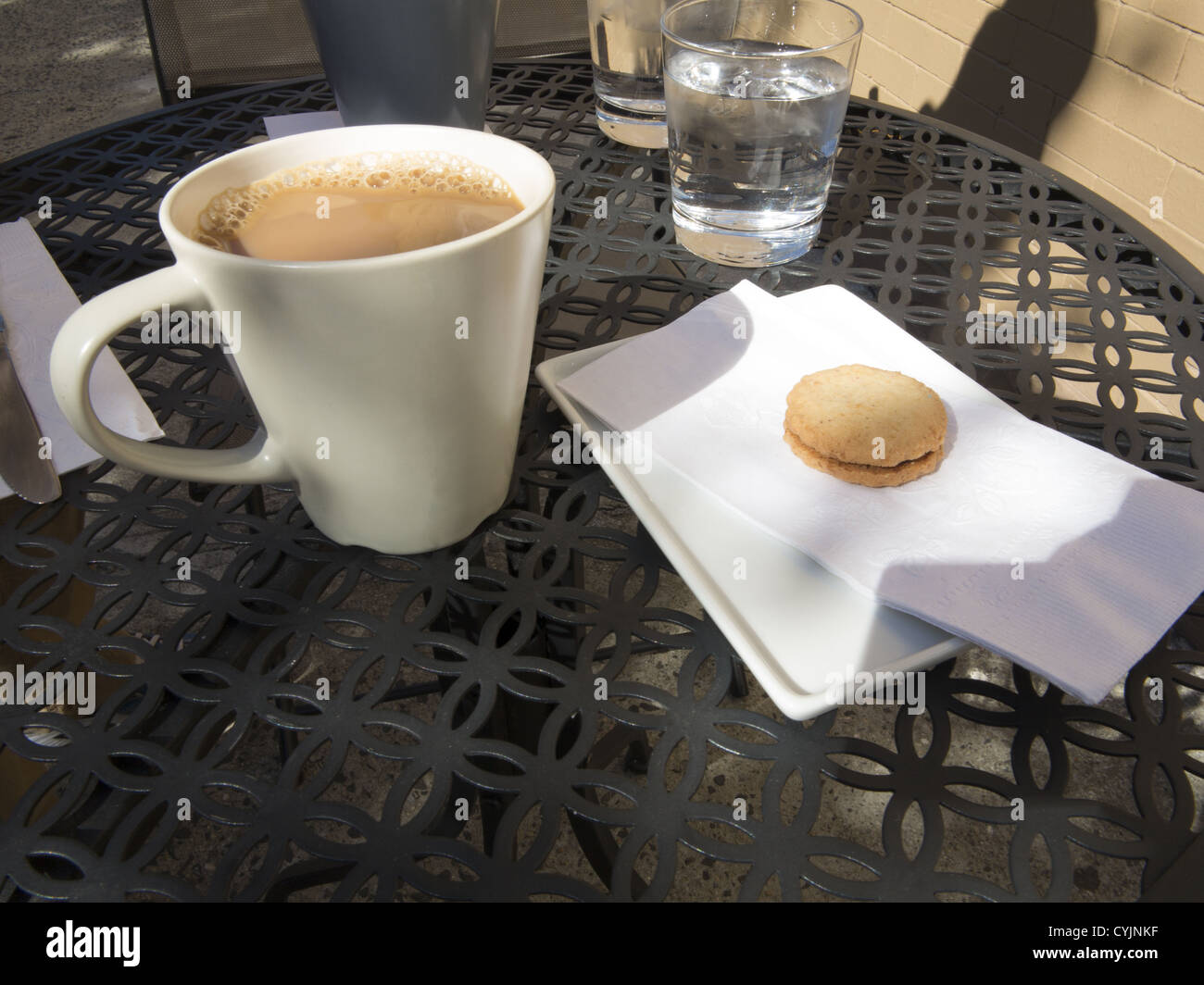 Coffee with cream and a sweet, window seat, Brooklyn cafe, NYC Stock ...