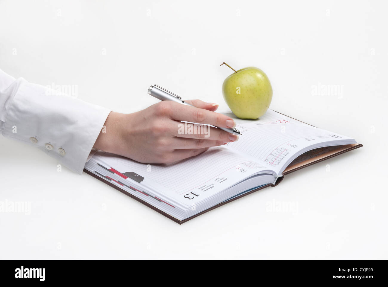 Woman hand making notes Stock Photo - Alamy