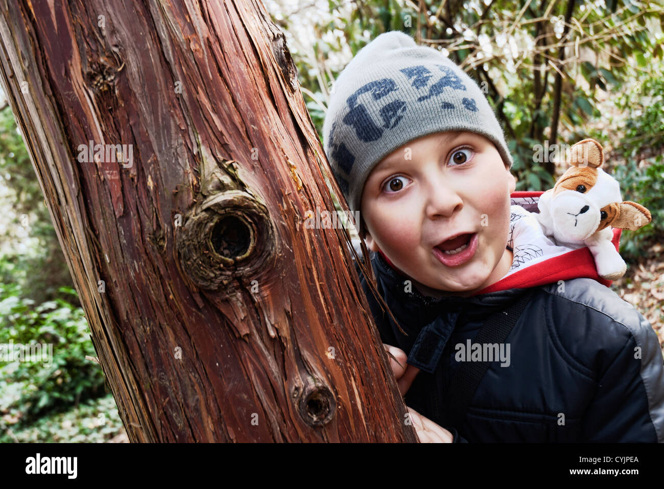 Funny boy by the tree Stock Photo - Alamy