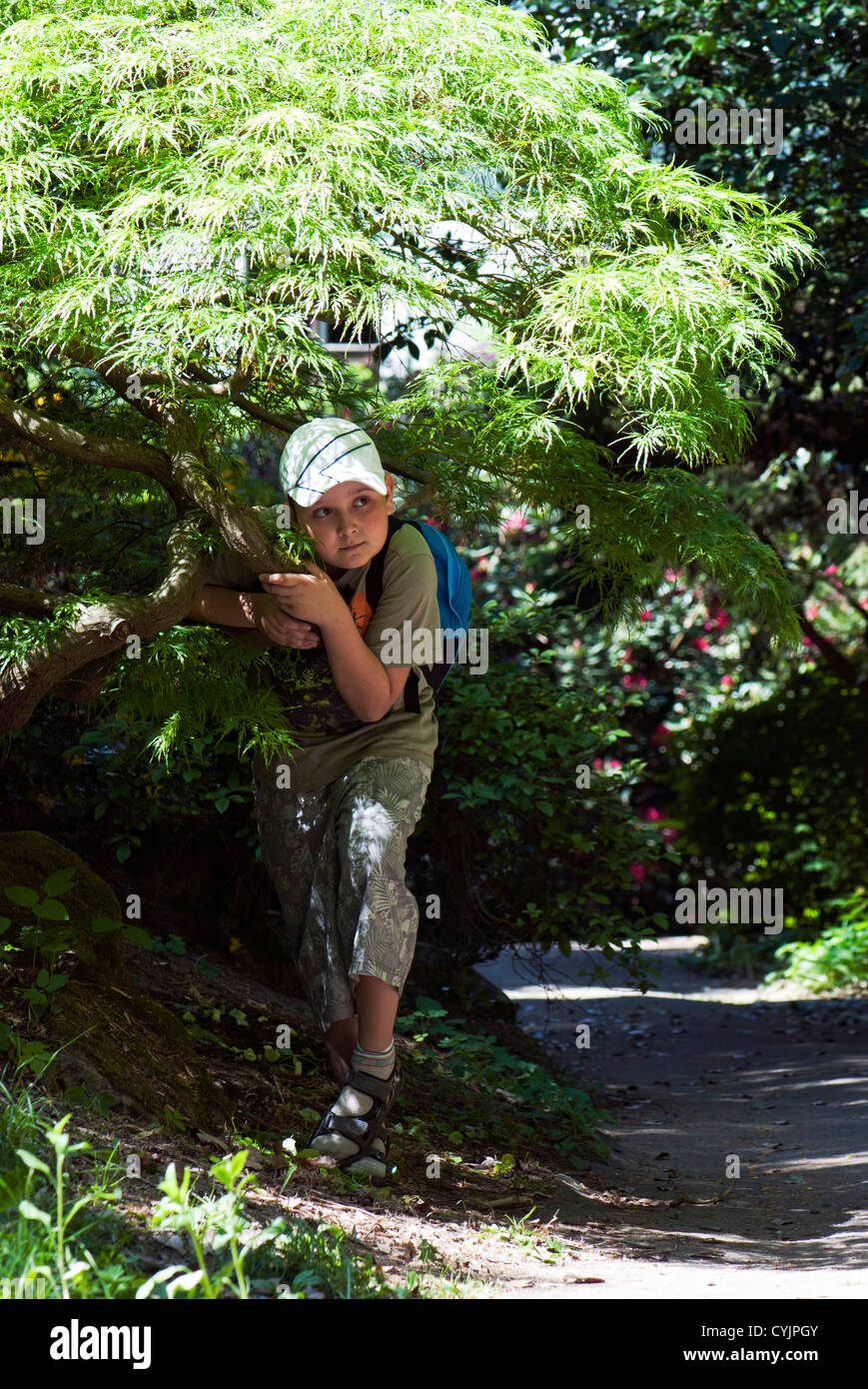 Crazy boy under the tree Stock Photo - Alamy