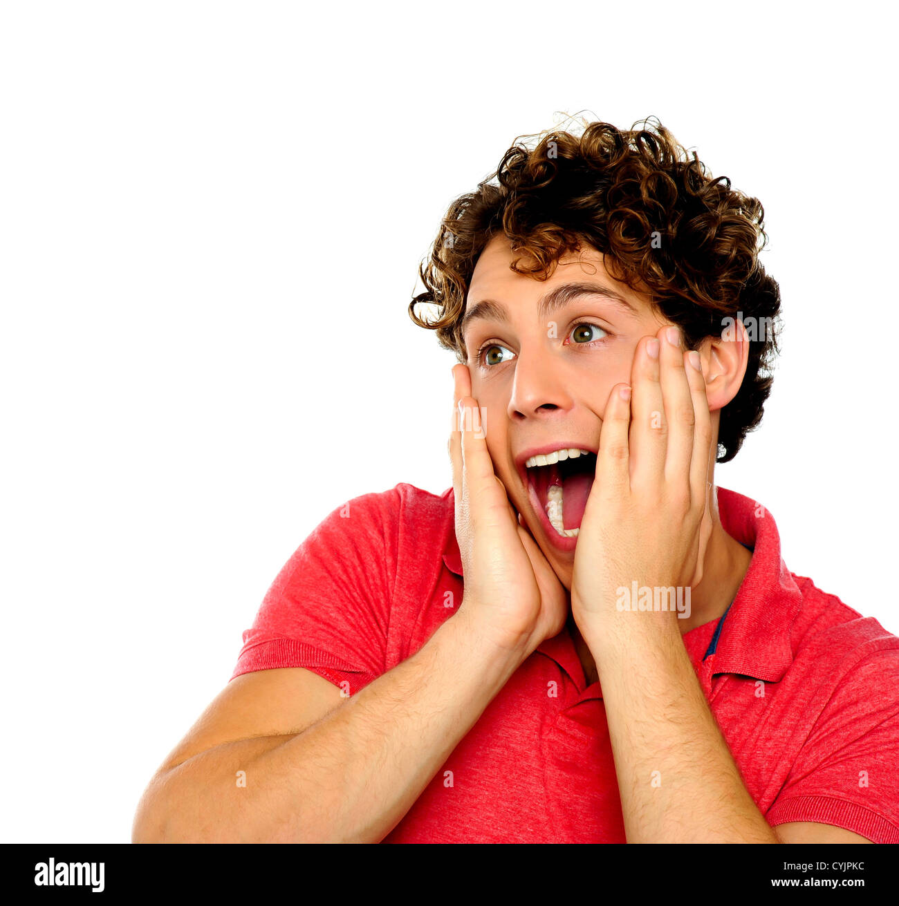A young man with a surprised look on his face. Hands on his cheek Stock ...