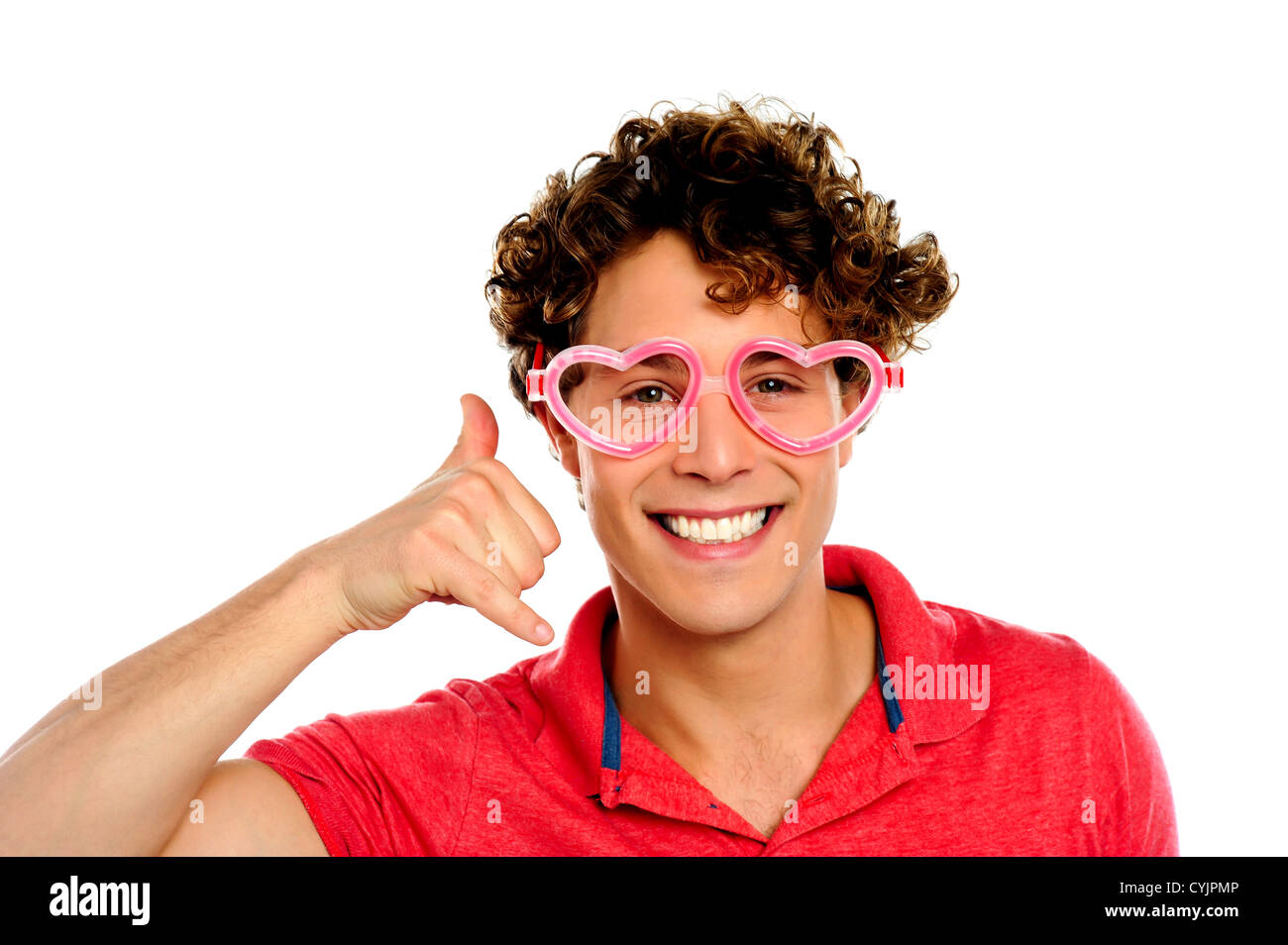 Boy posing with heart shaped eye-wear gesturing call Stock Photo - Alamy