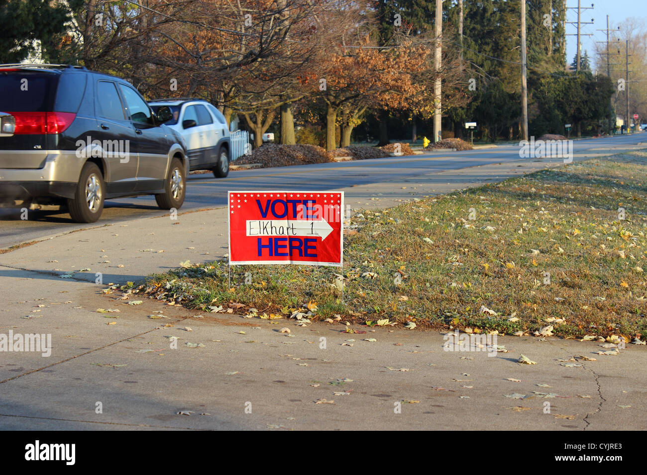 Vote here sign November USA Stock Photo - Alamy