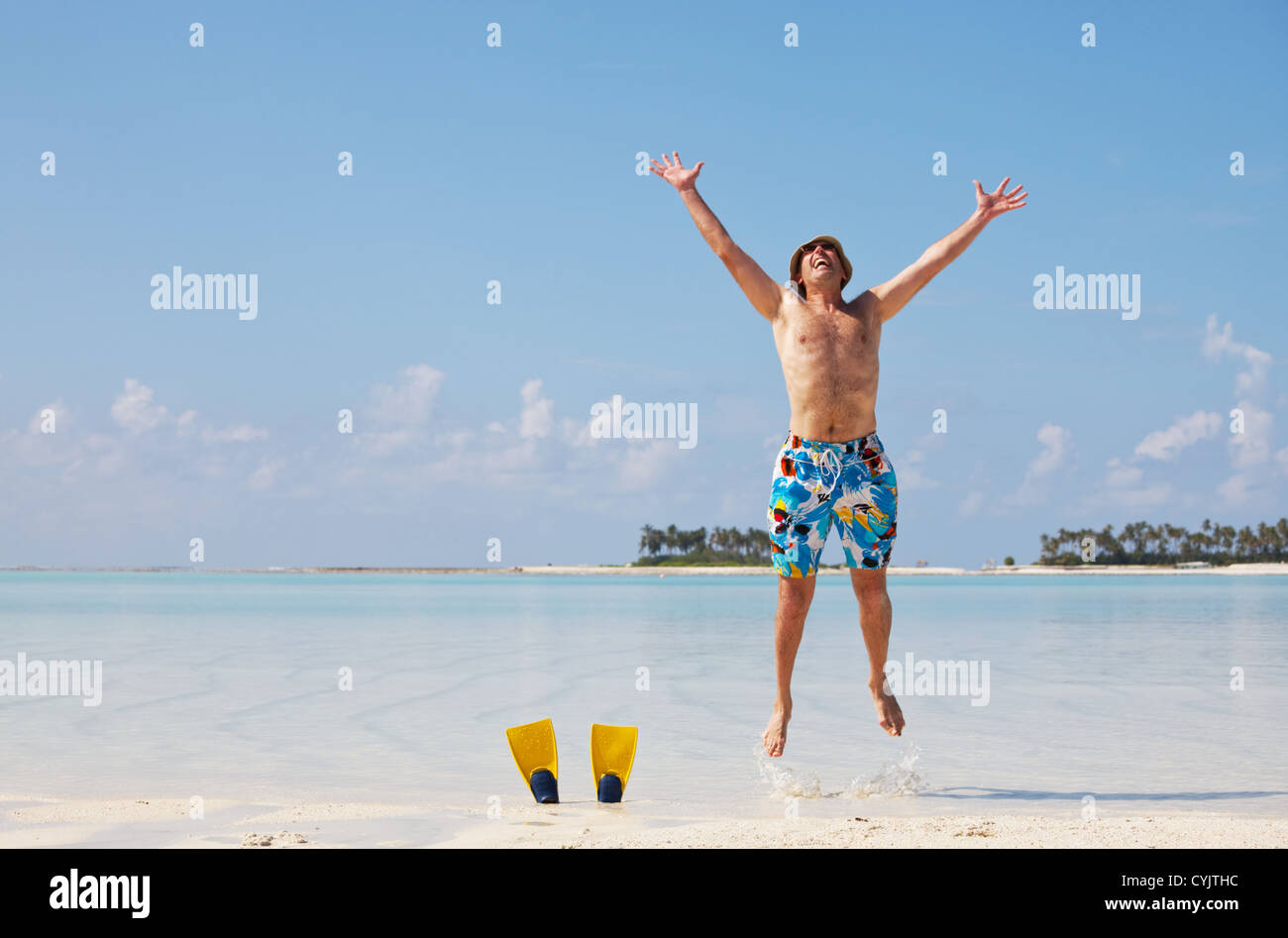 Man on beach Stock Photo - Alamy