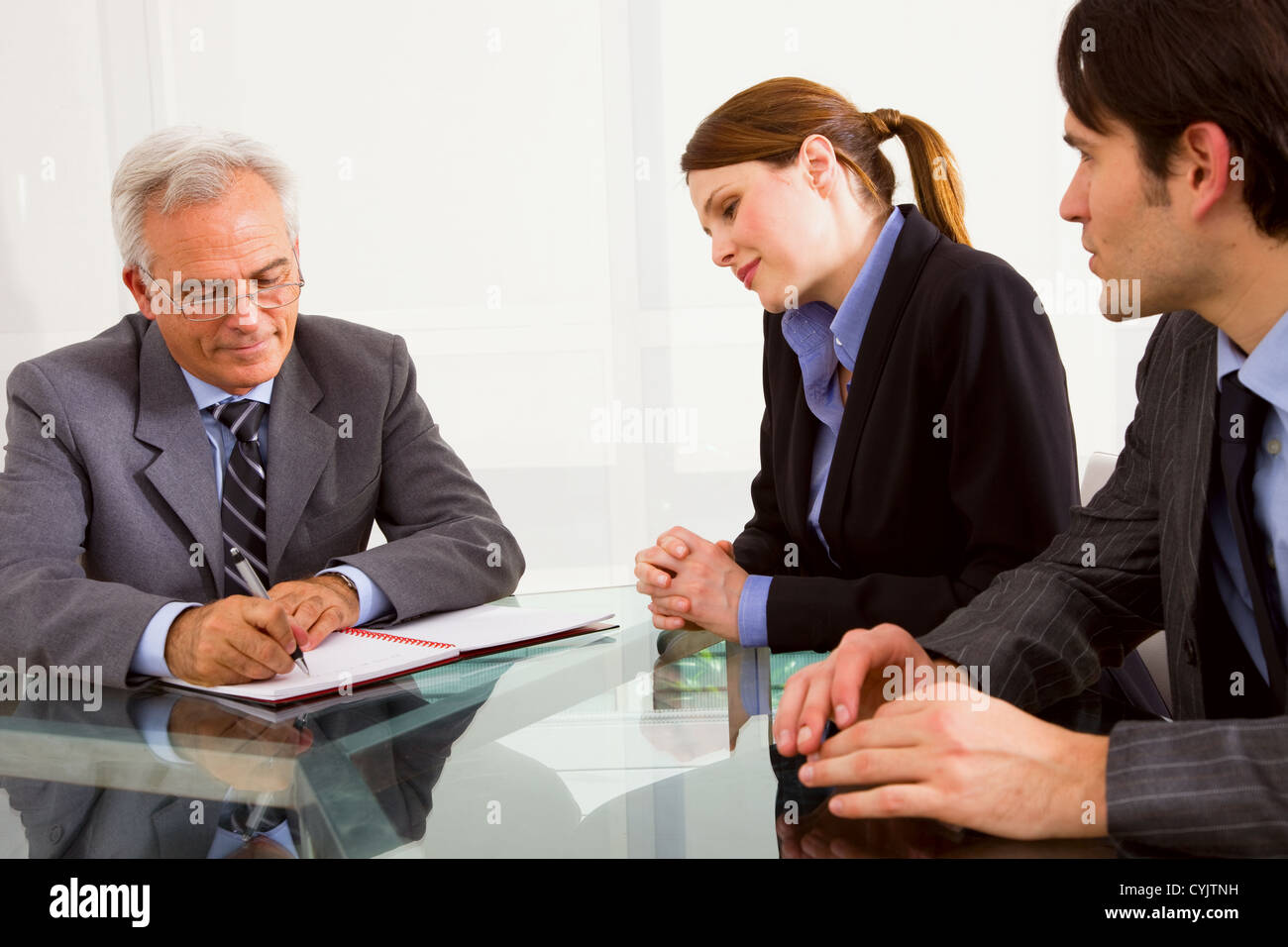two men and one woman during a job interview Stock Photo - Alamy