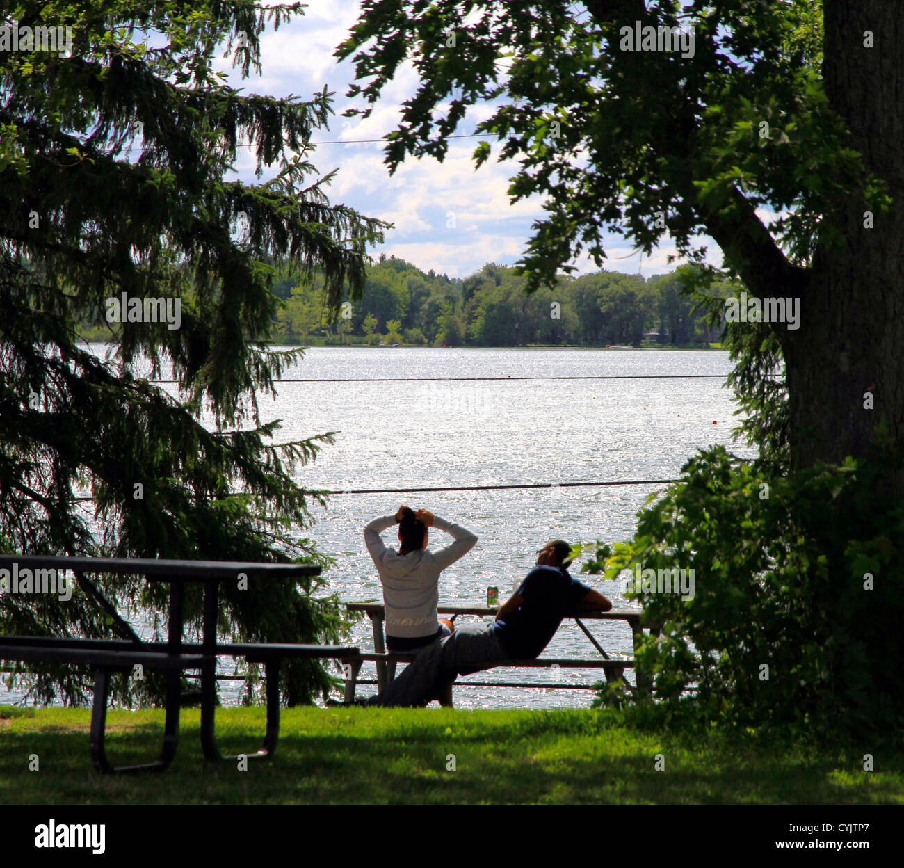 Chat by the lake Stock Photo - Alamy