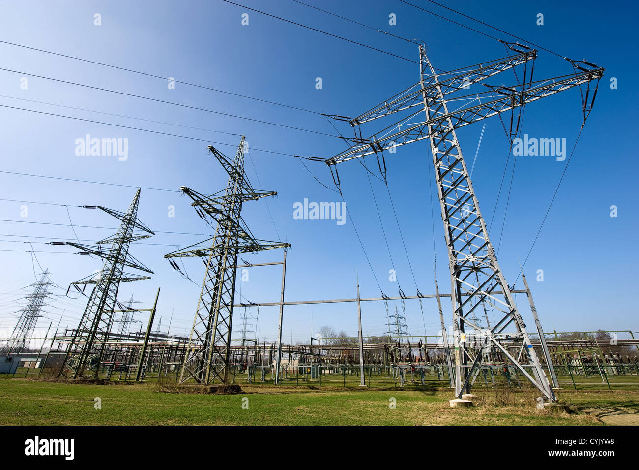 Electricity pylons near an electricity station Stock Photo - Alamy