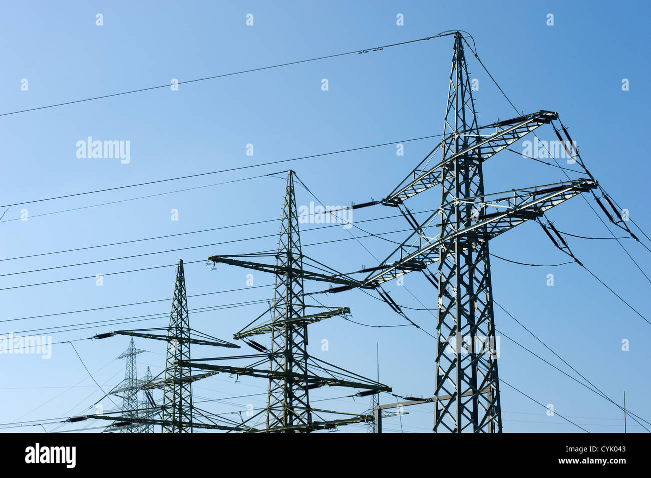 Five electricity pylons near an electricity station Stock Photo - Alamy