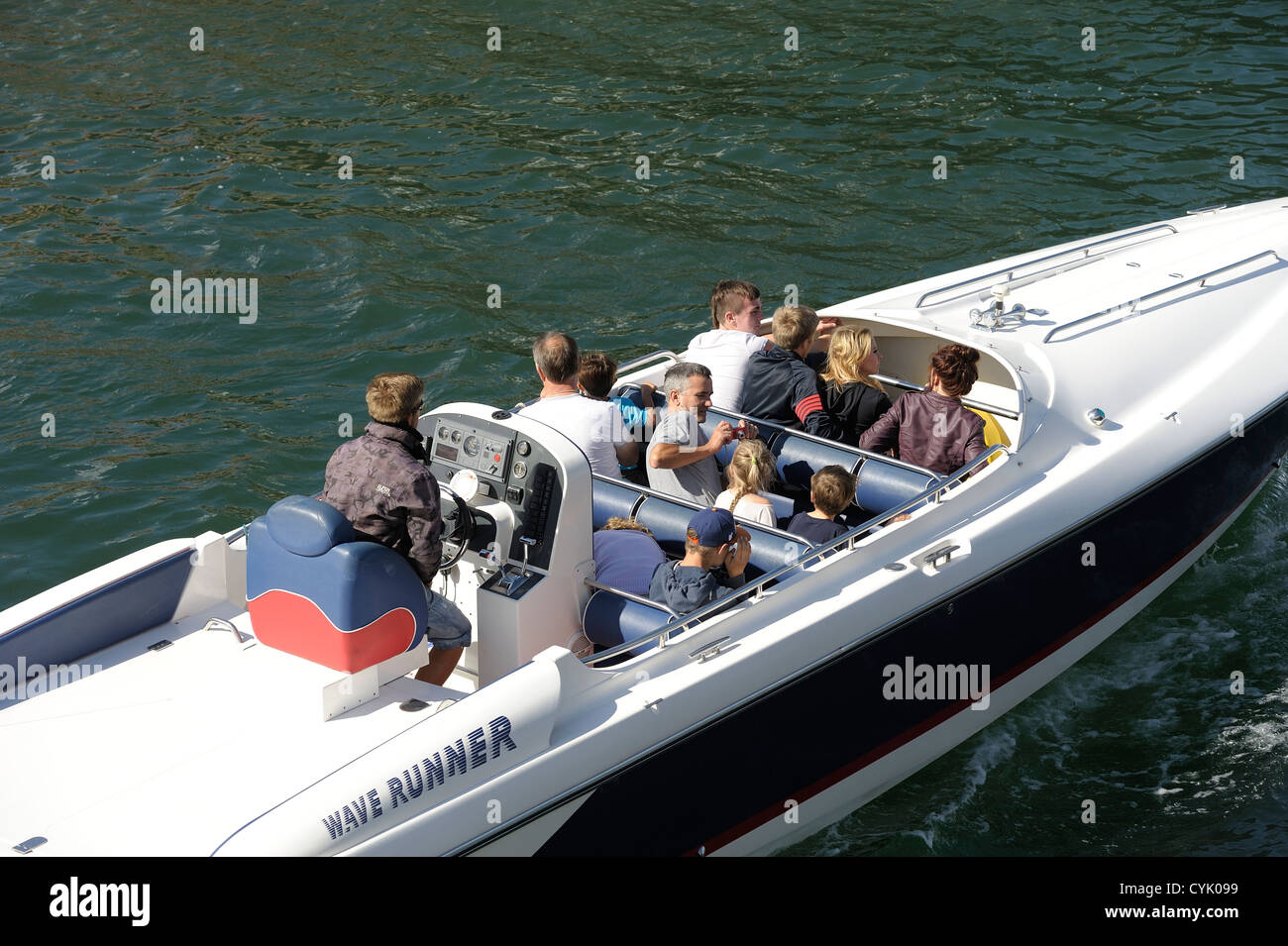 people on board the wave runner speedboat taking a trip round the bay ...