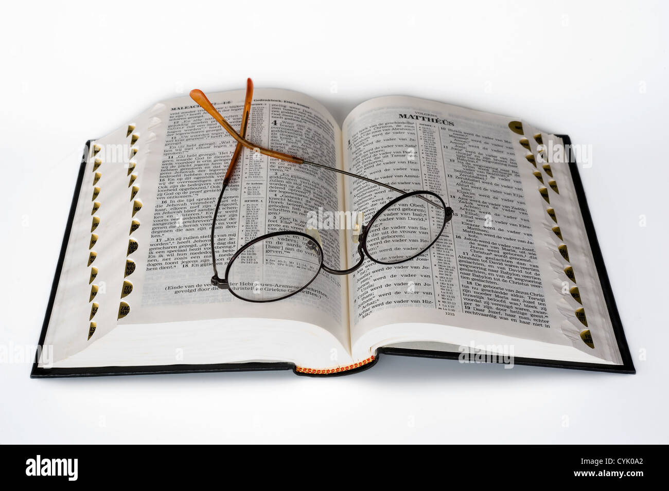 An open bible with a glasses lying on it Stock Photo - Alamy