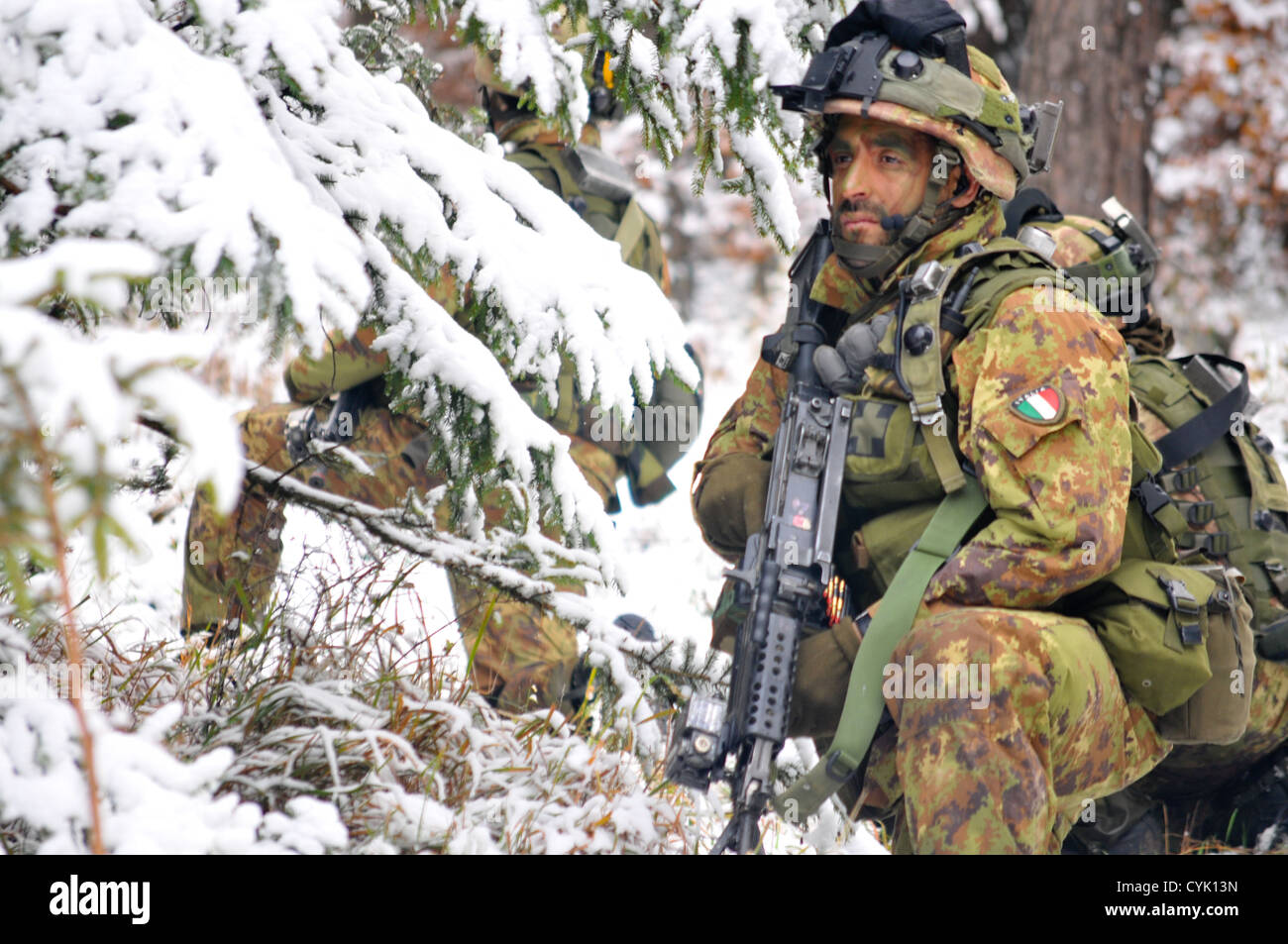 An Italian soldier from the 183rd Airborne Regiment performs security ...