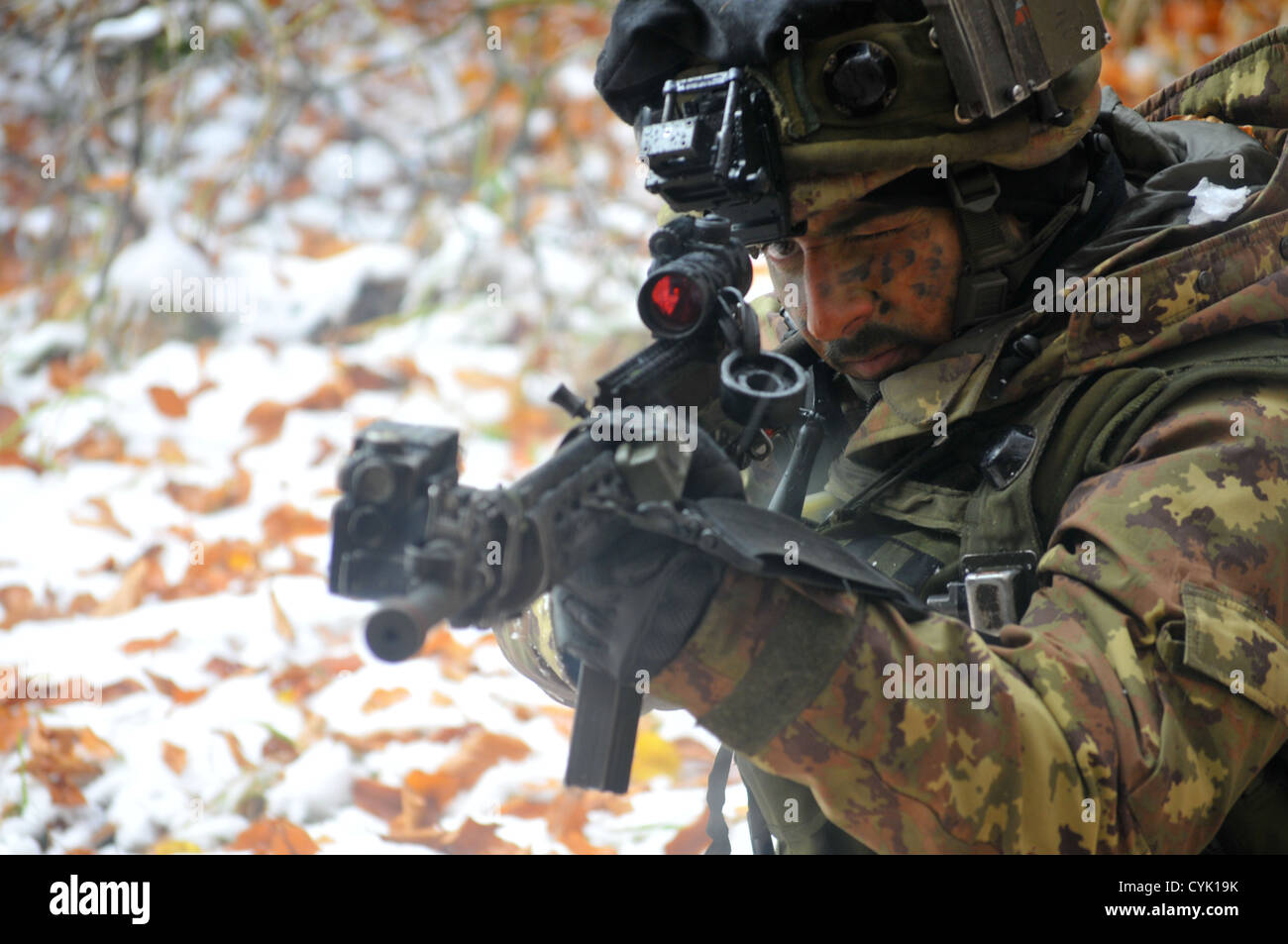 An Italian soldier from the 183rd Airborne Regiment aims his SCP70 ...