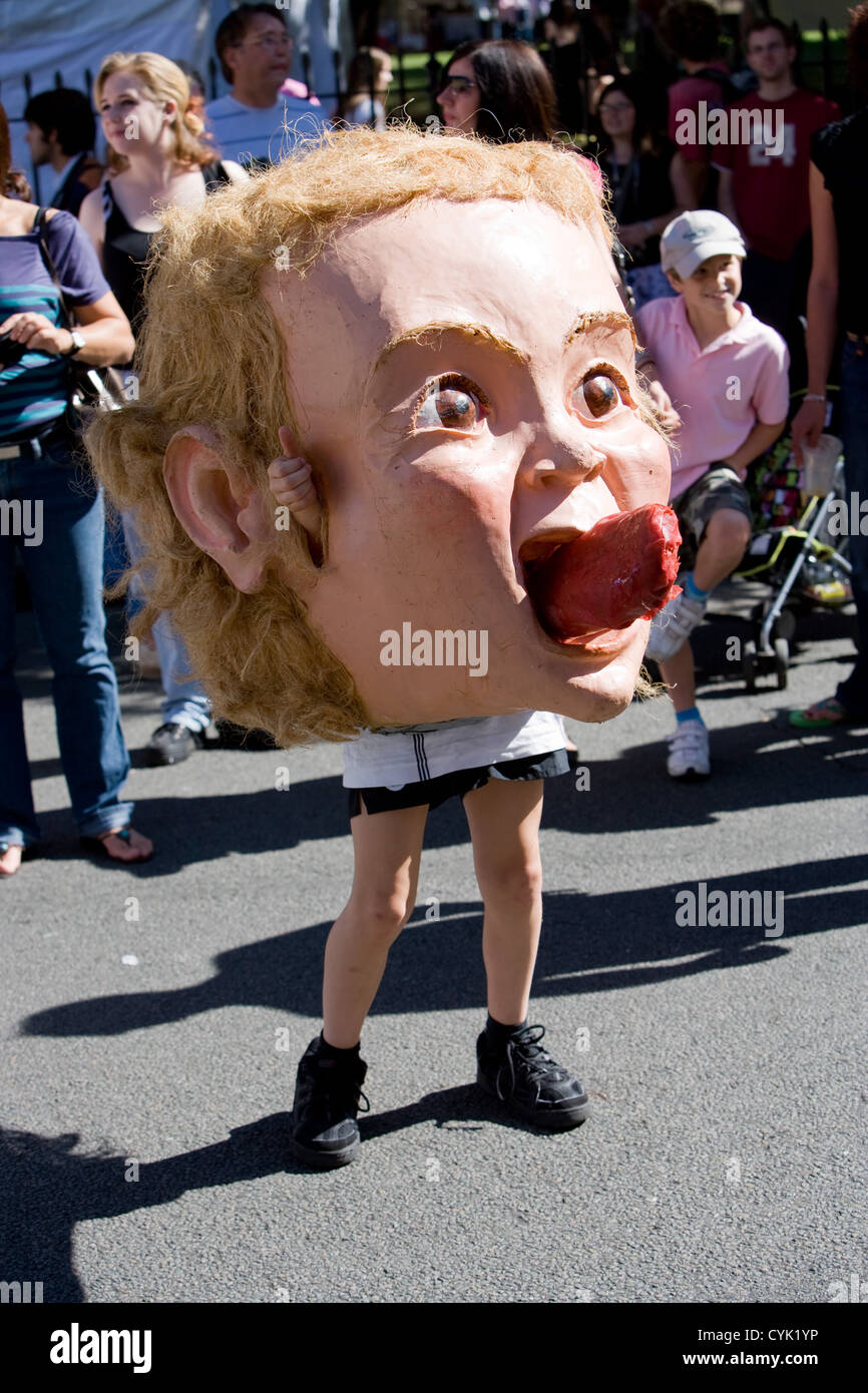 Small boy walking inside a large head at St Pauls Afrikan Caribbean ...