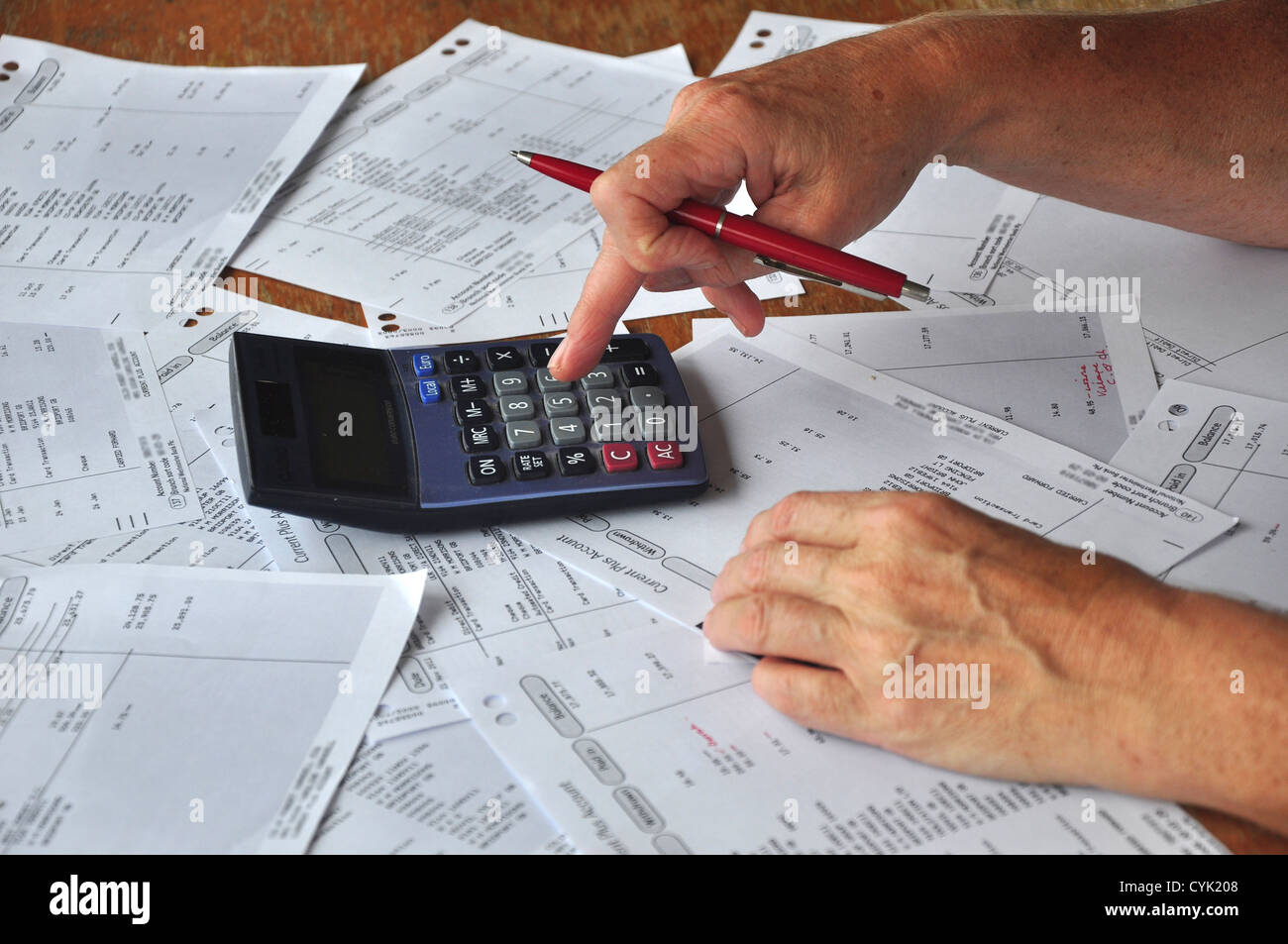 Checking the bank statements UK Stock Photo - Alamy