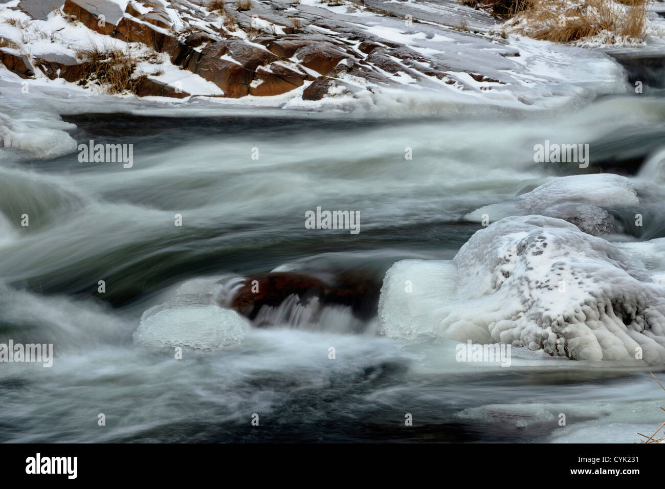 Junction Creek shoreline with a dusting of snow and a buildup of ice ...