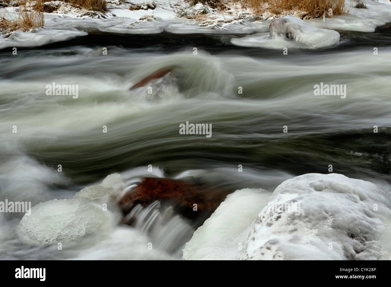 Junction Creek shoreline with a dusting of snow and a buildup of ice ...