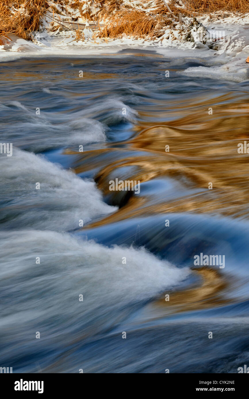 Junction Creek shoreline with a dusting of snow and a buildup of ice ...
