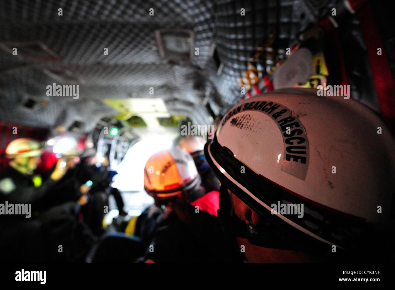 Members of the Maryland Urban Search and Rescue Task Force fly aboard a ...