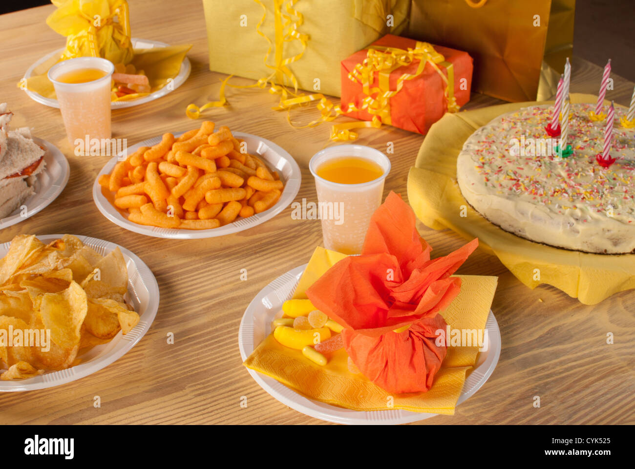 Snacks and colorful present wrappings on a birthday table Stock Photo ...