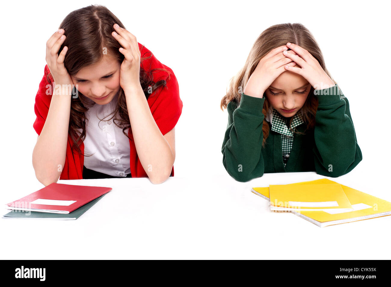 Confused students holding their heads and looking down Stock Photo - Alamy