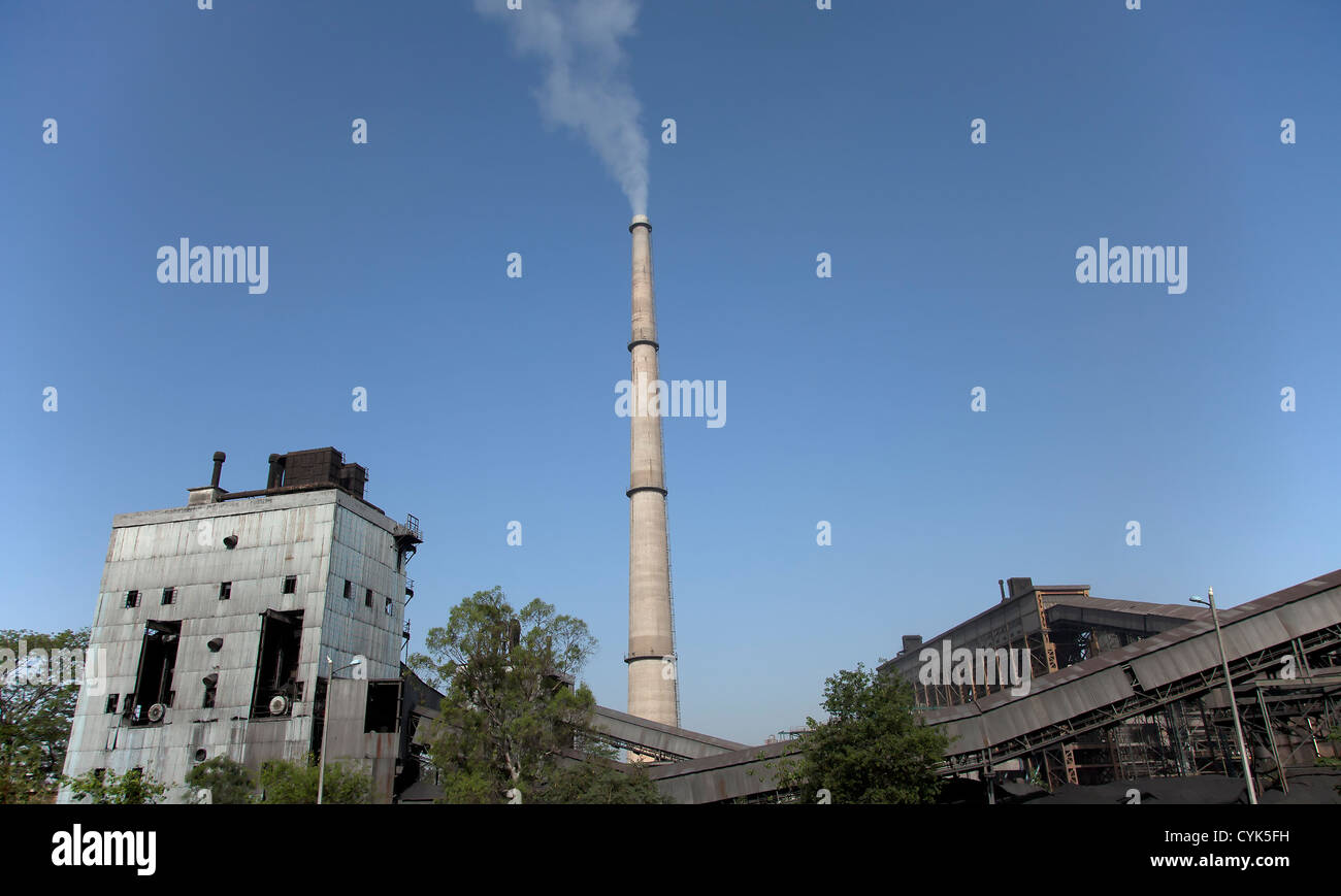 Factory chimney releasing steam Stock Photo - Alamy