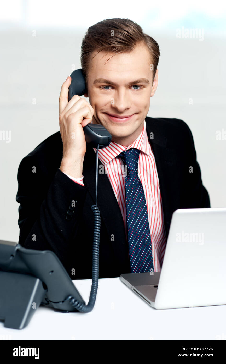 Smart businessman communicating on phone inside the office Stock Photo ...