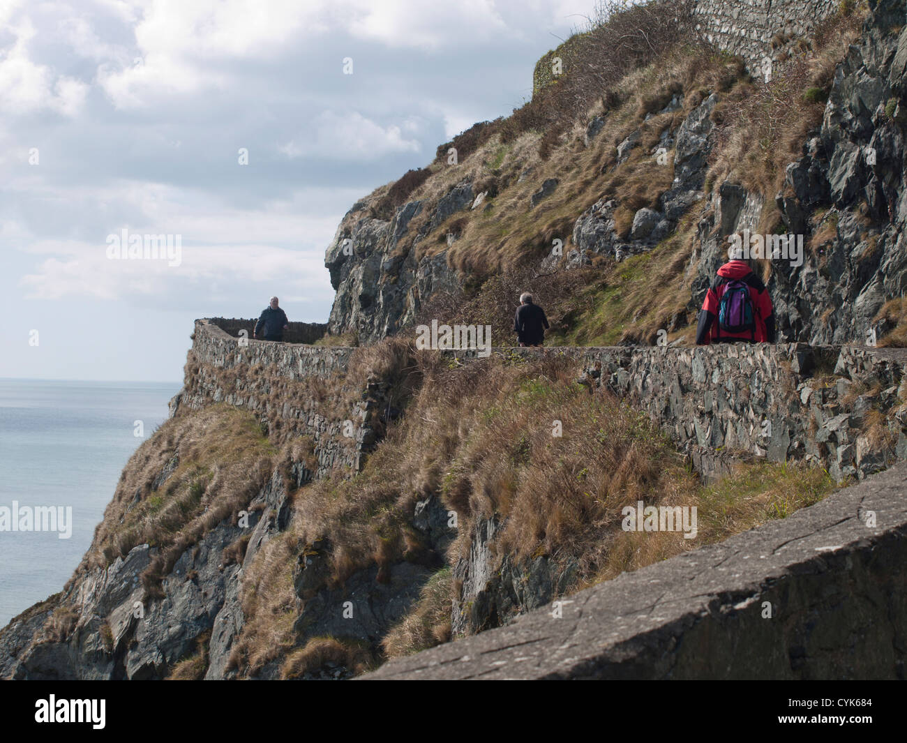 Bray to Greystones, cliff walk , three male hikers passing on the ...