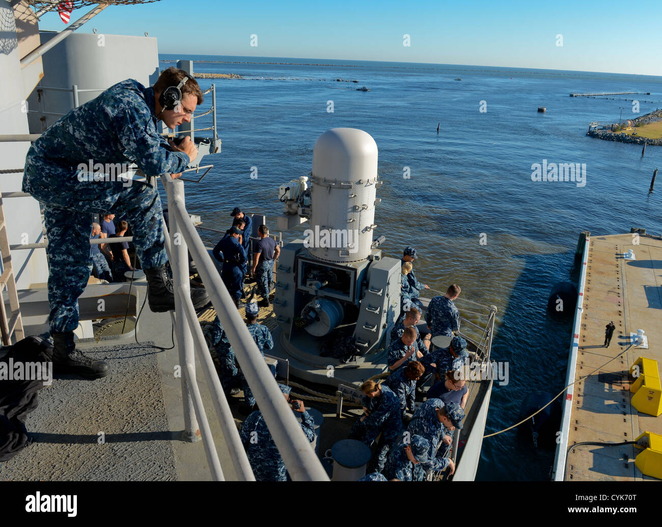 Seaman Kenneth Forquer assists with communication duties during mooring ...