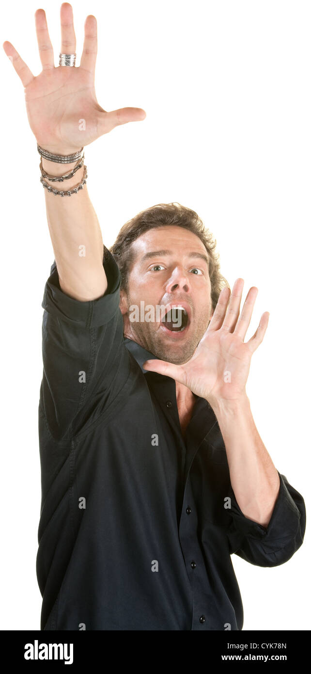 Scared man reaching up over white background Stock Photo - Alamy