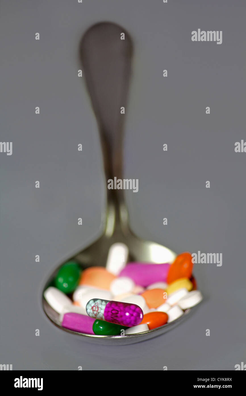 Stack of Tablets in a Spoon Stock Photo - Alamy