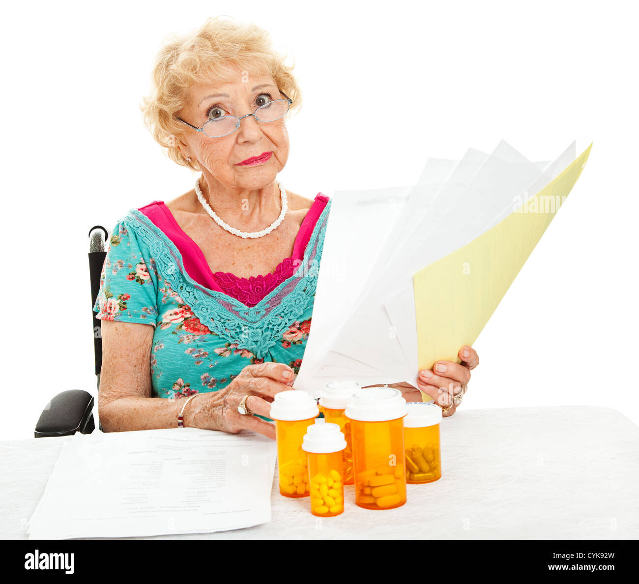 Disabled senior woman, unhappy about mounting medical expenses. White ...