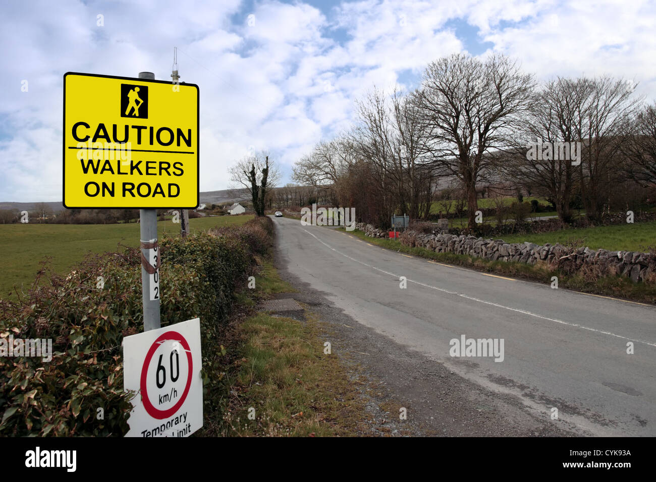 warning sign for drivers to be careful of tourists walking on country ...