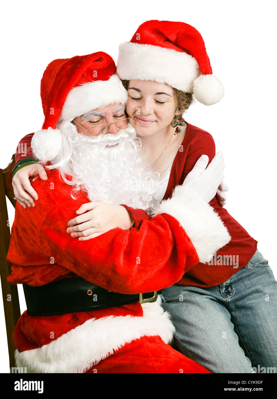 Adolescent girl sitting on Santa Claus' Lap, getting a hug. We're never ...
