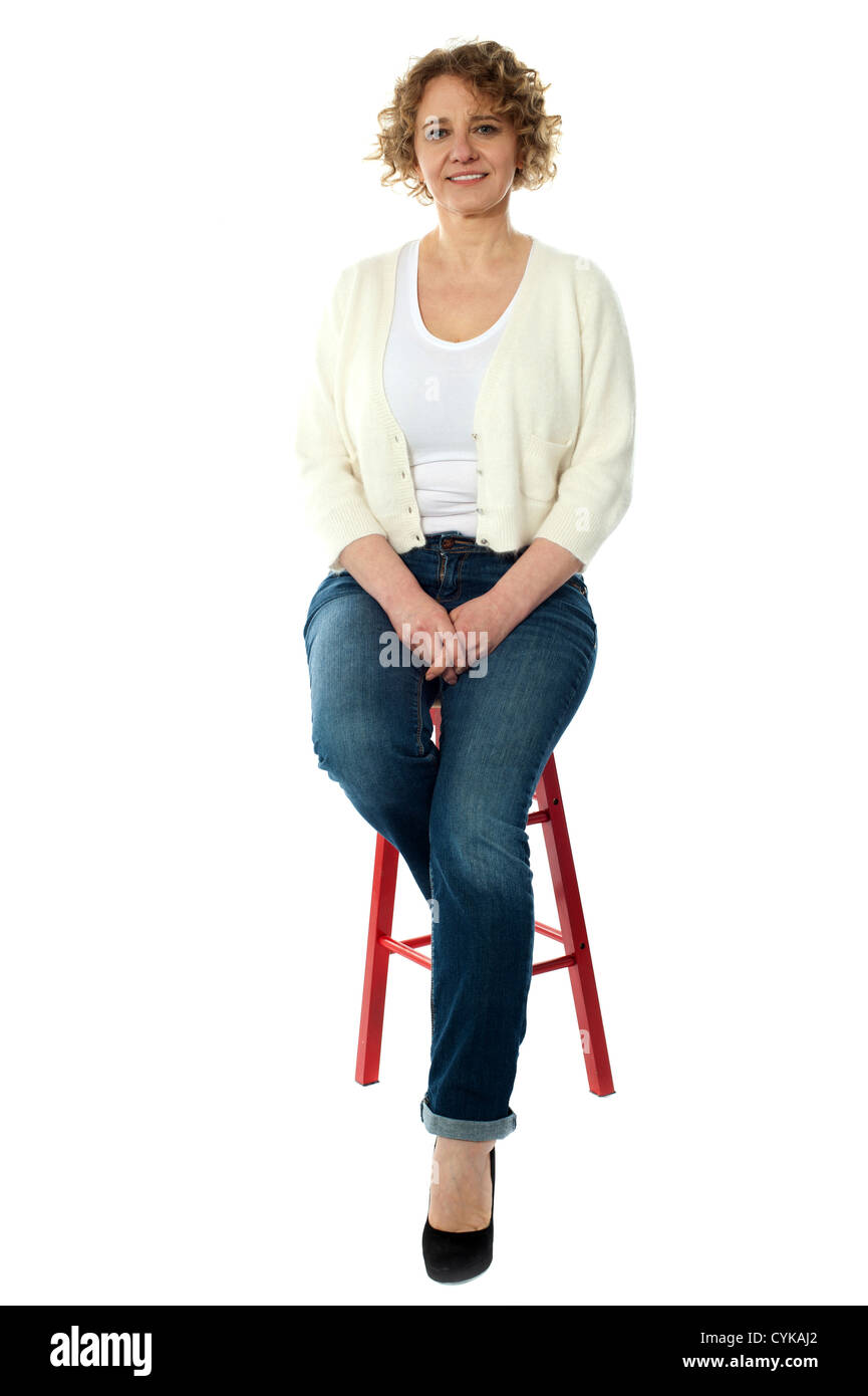 Sitting on stool hi-res stock photography and images - Alamy
