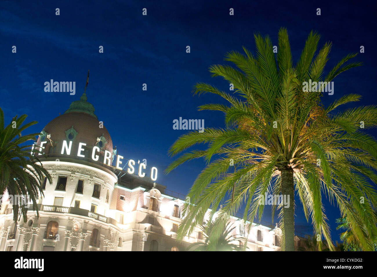 Hotel Le Negresco and palm tree at night Promenade des Anglais Nice ...